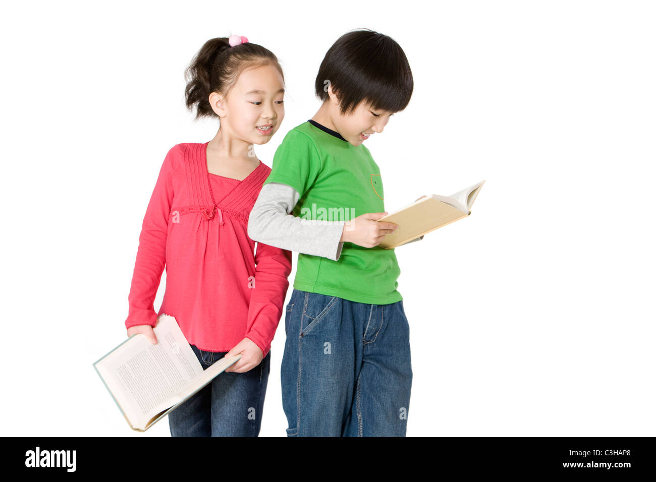 Girl peeking over her friend's shoulder Stock Photo - Alamy