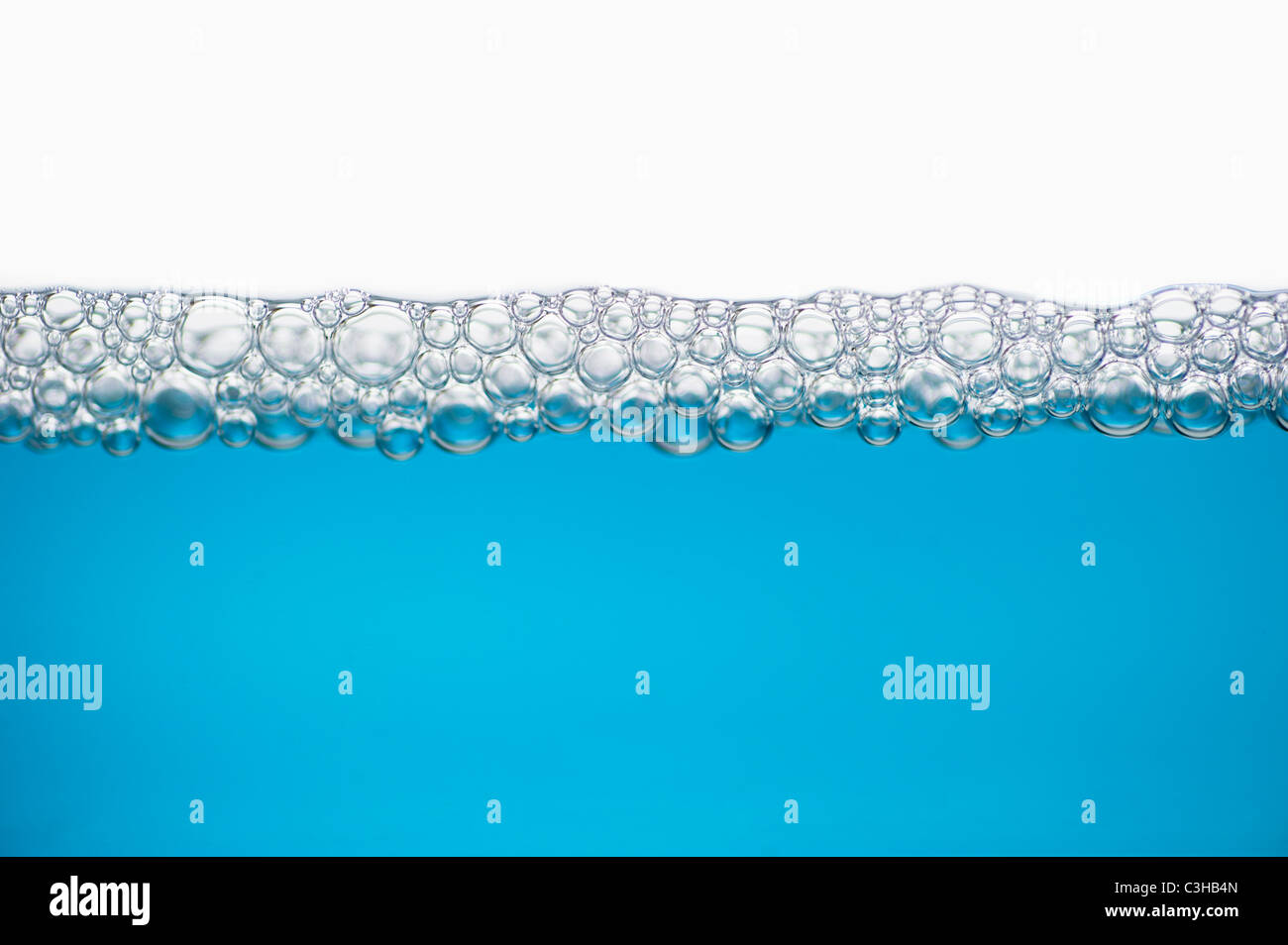 Close up of soap bubbles on water surface Stock Photo - Alamy