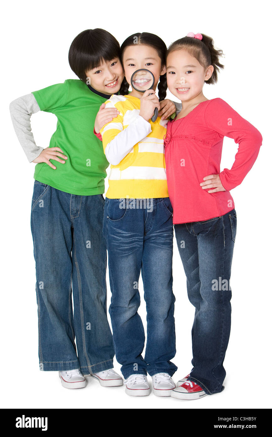 Three friends standing together Stock Photo - Alamy