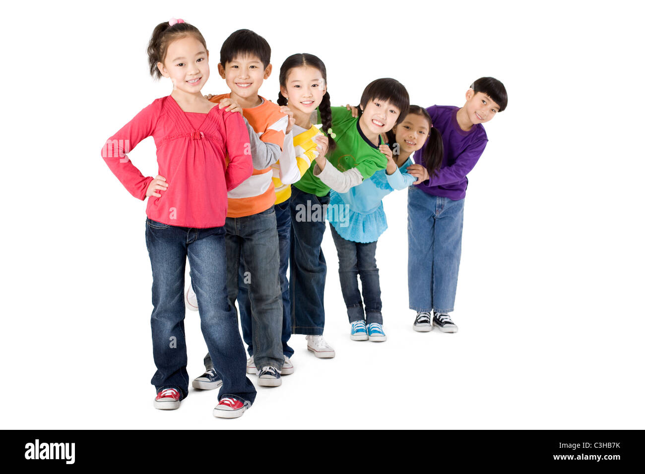 A group of friends standing in a row Stock Photo - Alamy