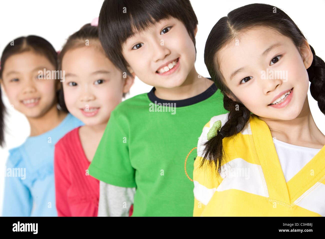A group of friends standing in a row Stock Photo - Alamy
