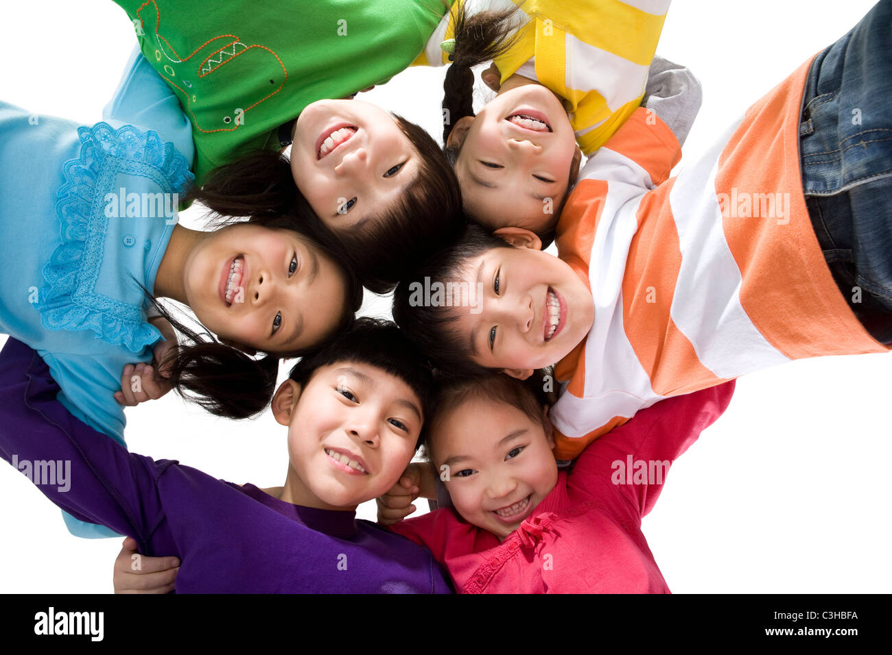 A group of friends in a huddle Stock Photo - Alamy