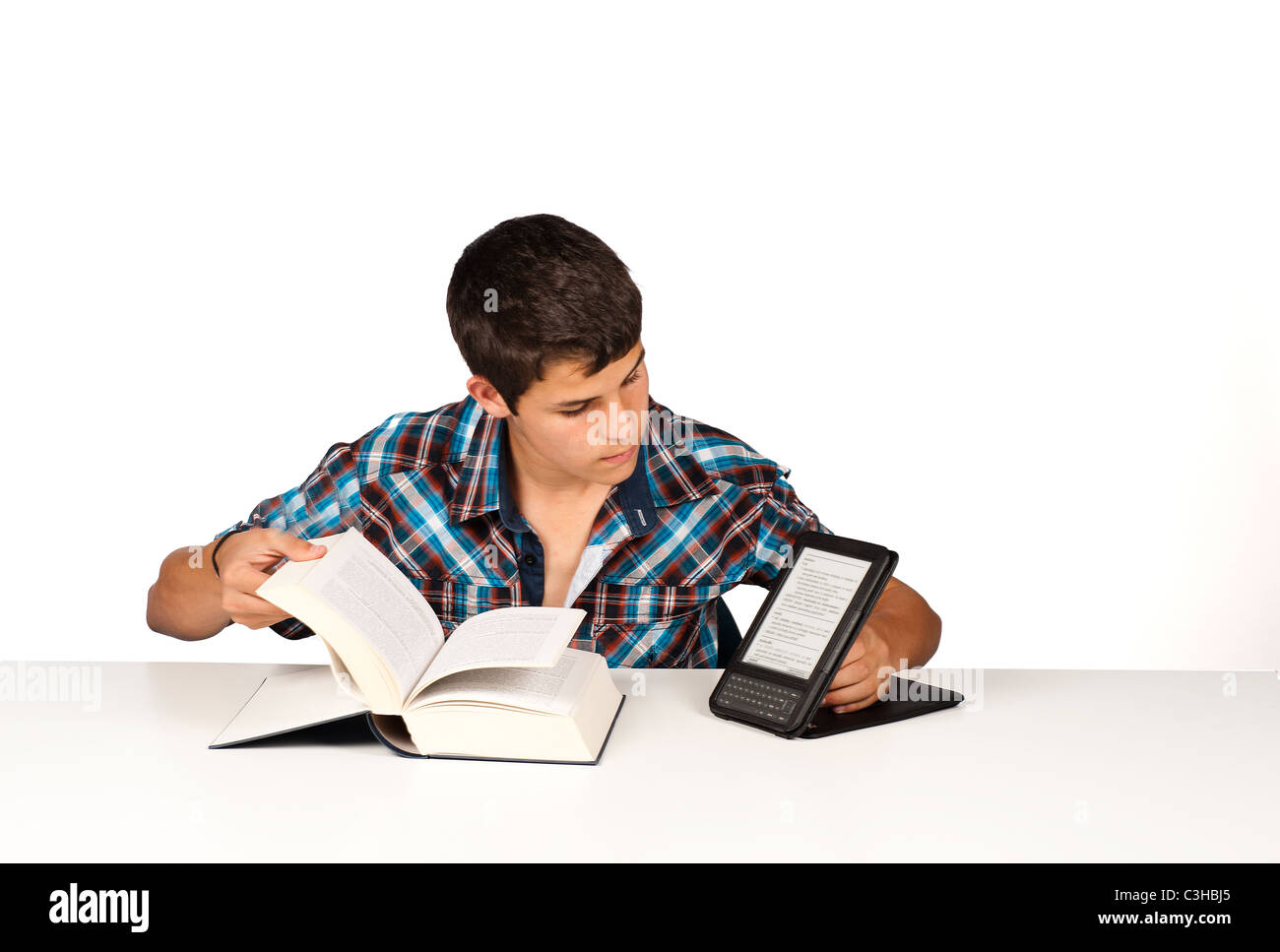 Student comparing a traditional book with its modern version Stock ...