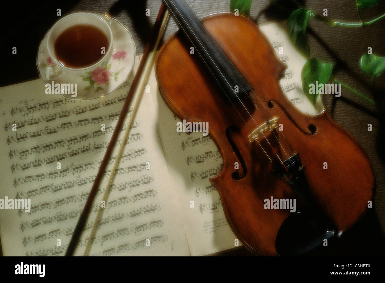 Tea time violin and sheet music Stock Photo - Alamy