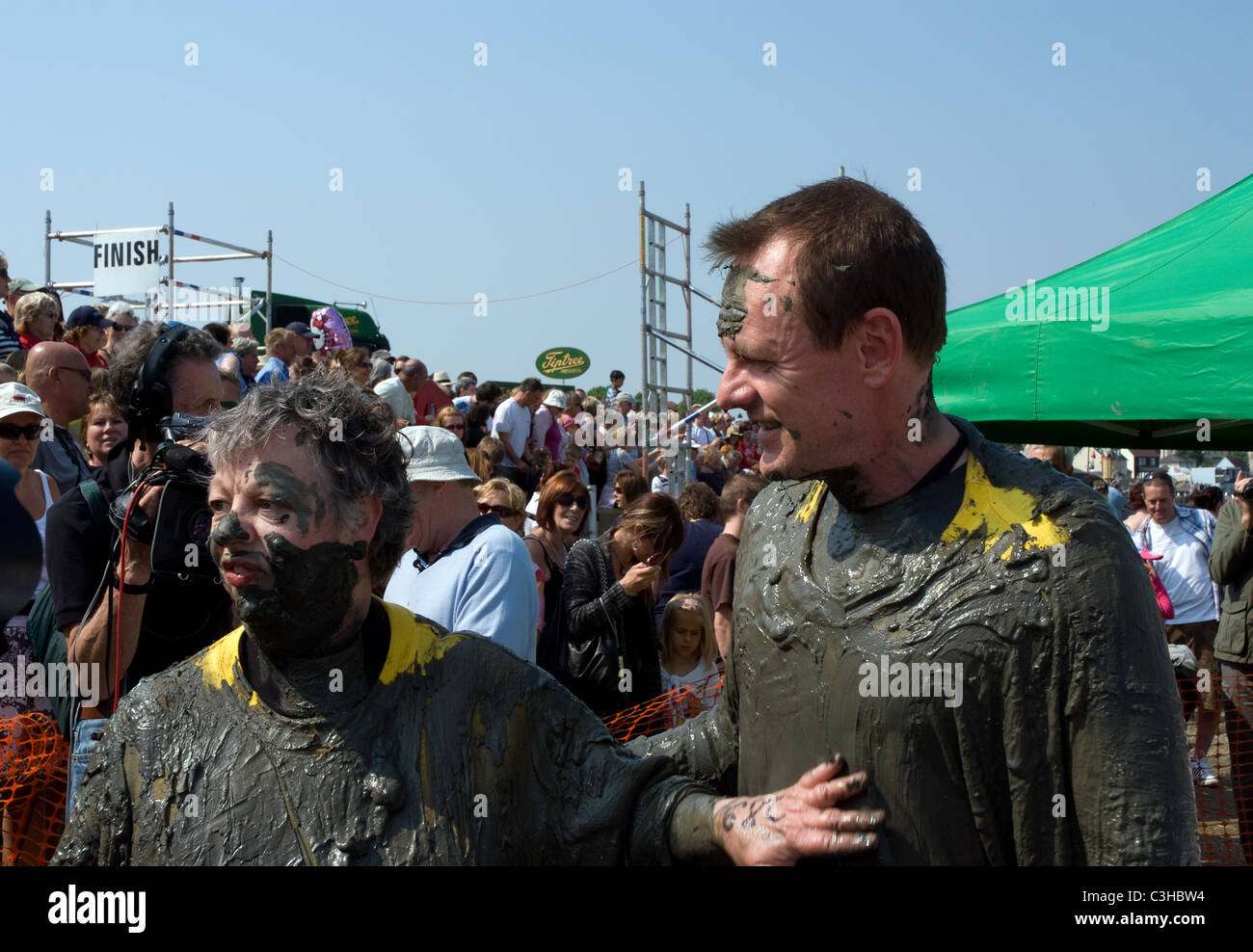 comedians Jo brand and Shaun lock covered in mud after taking part in ...