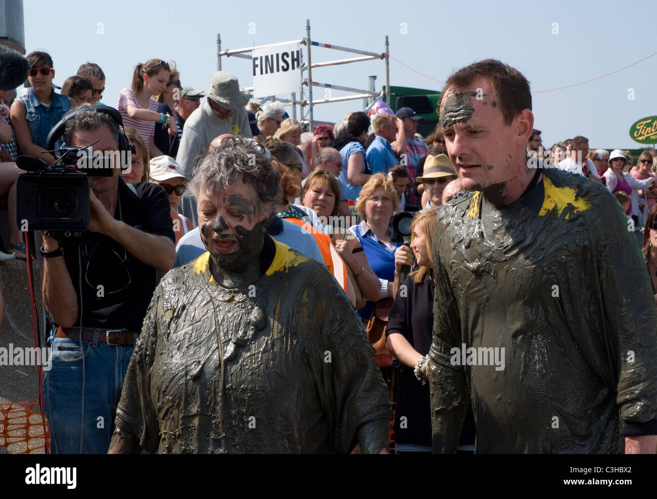comedians Jo brand and Shaun lock covered in mud after taking part in ...