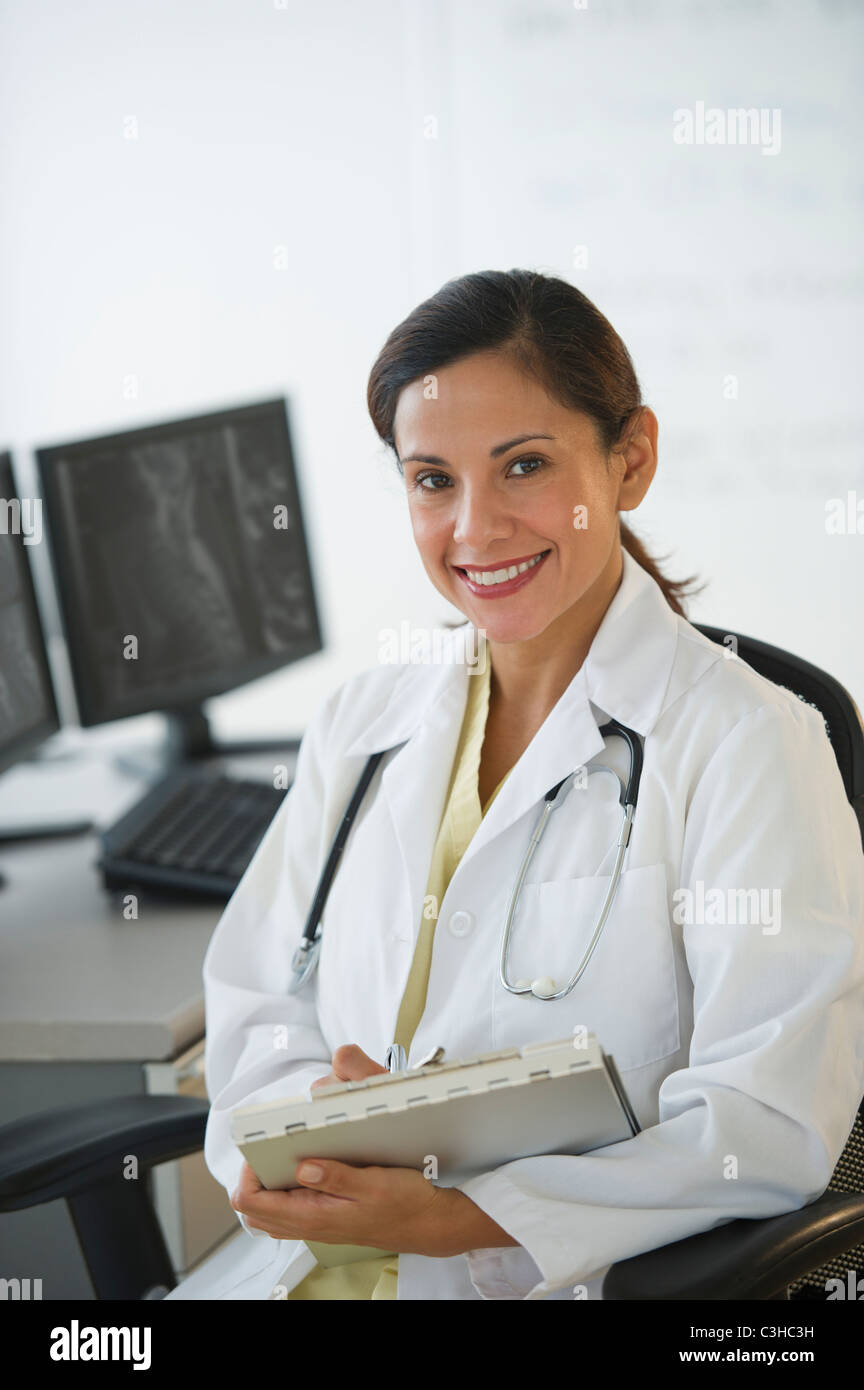 Portrait of smiling female doctor Stock Photo - Alamy