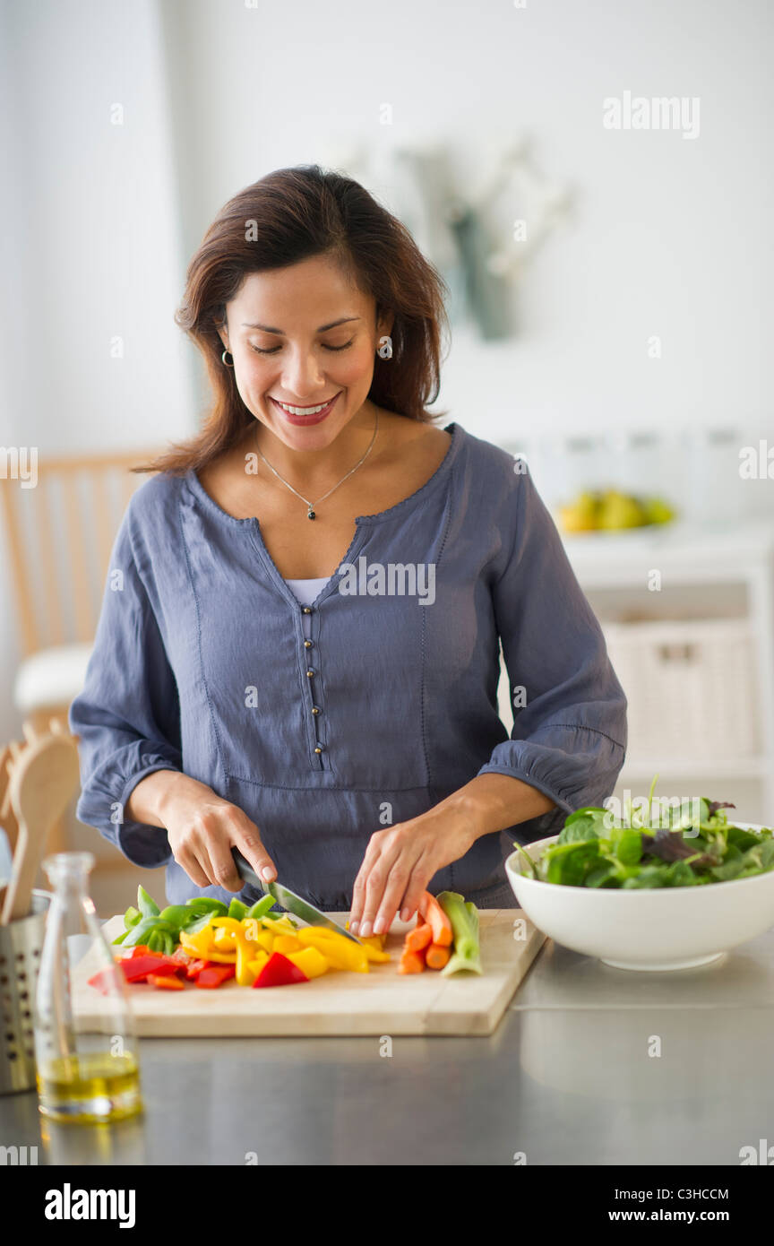 Woman preparing food in kitchen Stock Photo - Alamy
