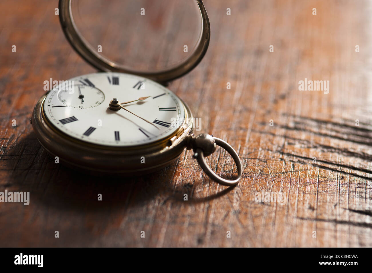 Close up of pocket watch on scratched table Stock Photo - Alamy