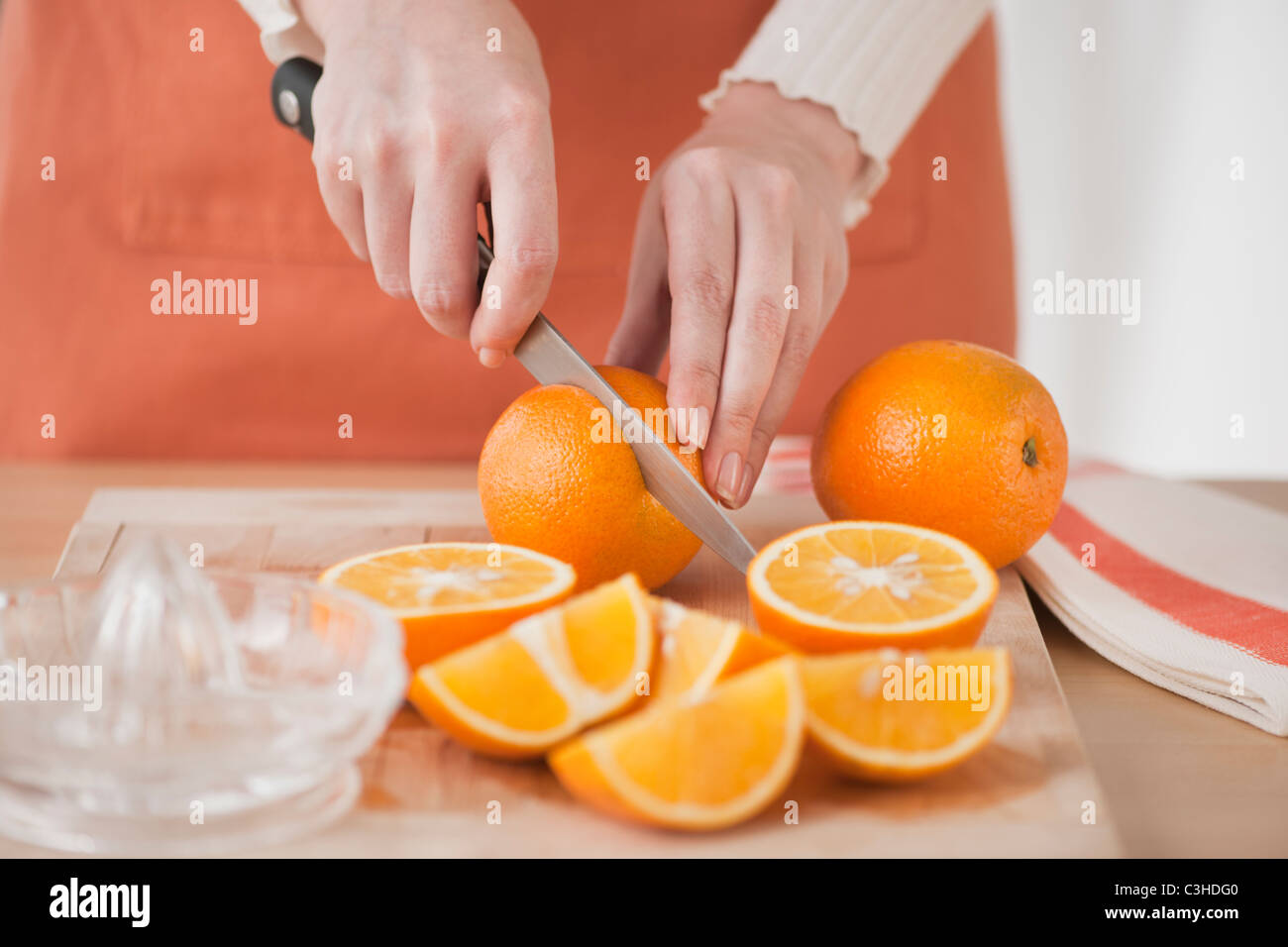 Cutting oranges hi-res stock photography and images - Alamy