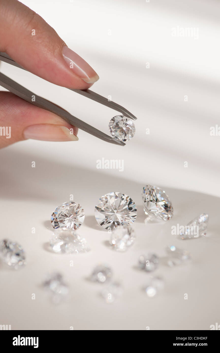 Woman holding diamonds hi-res stock photography and images - Alamy