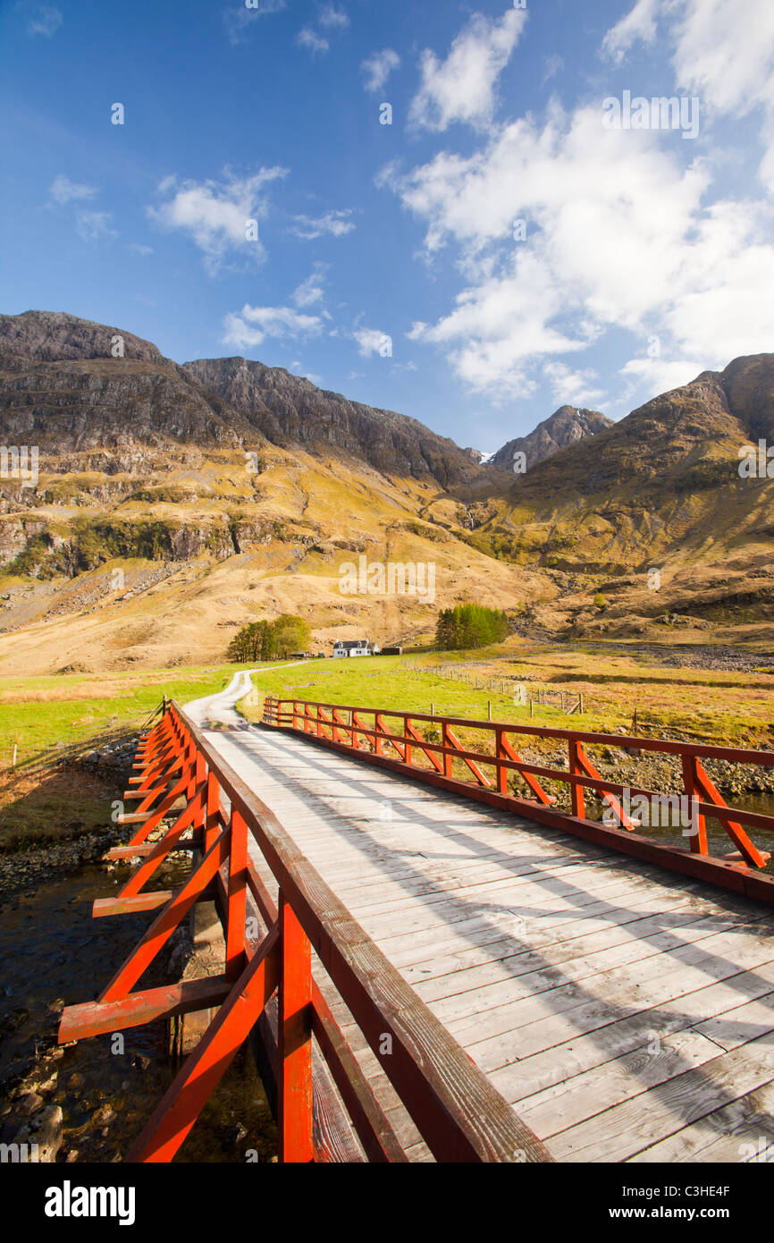 A bridge crossing the River Coe in Glen Coe, looking up to the summit ...