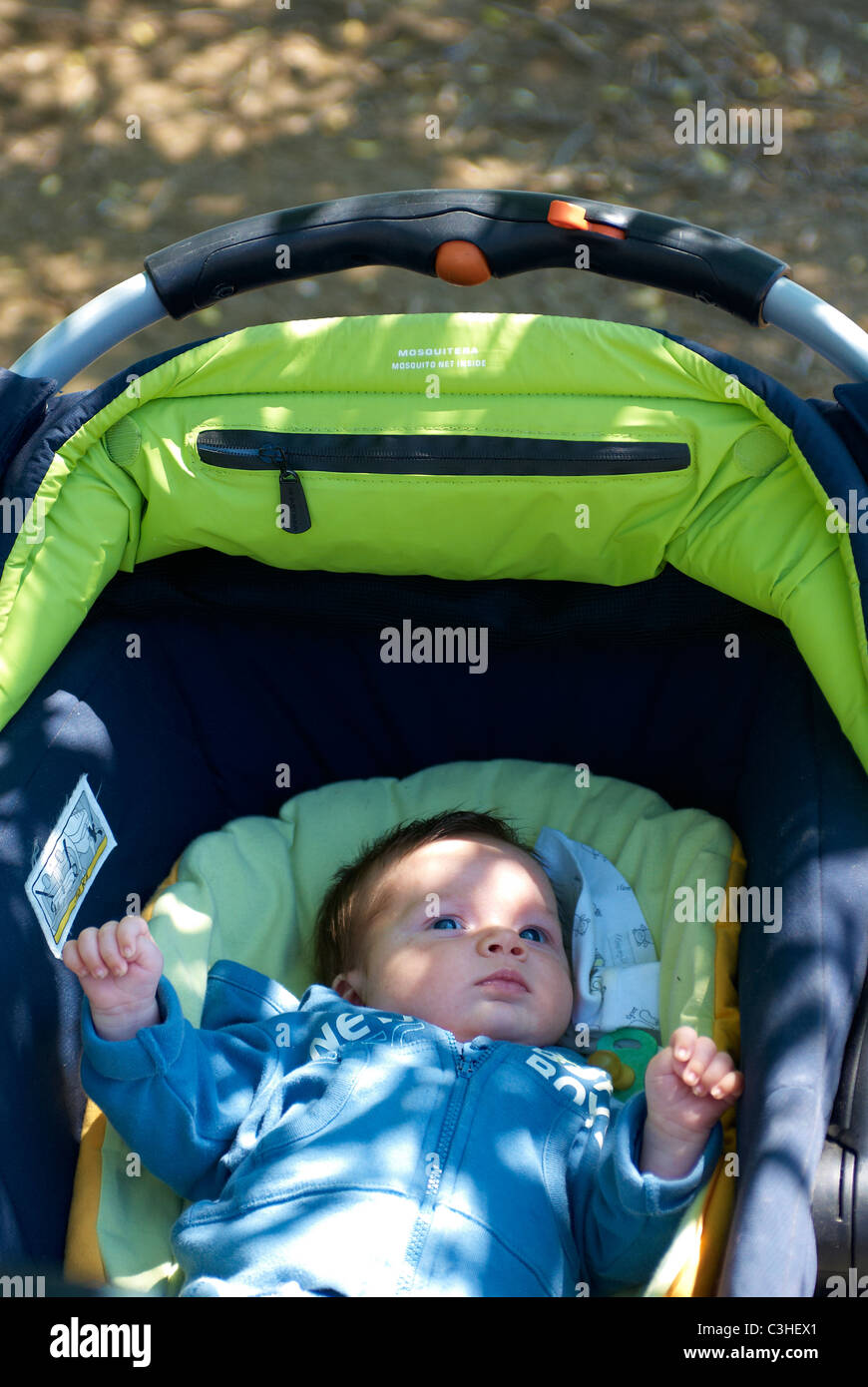 Child baby girl in buggy - pram - outside Stock Photo - Alamy