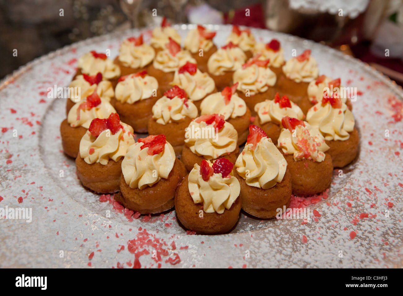 Italian baba with cream and strawberry Stock Photo - Alamy