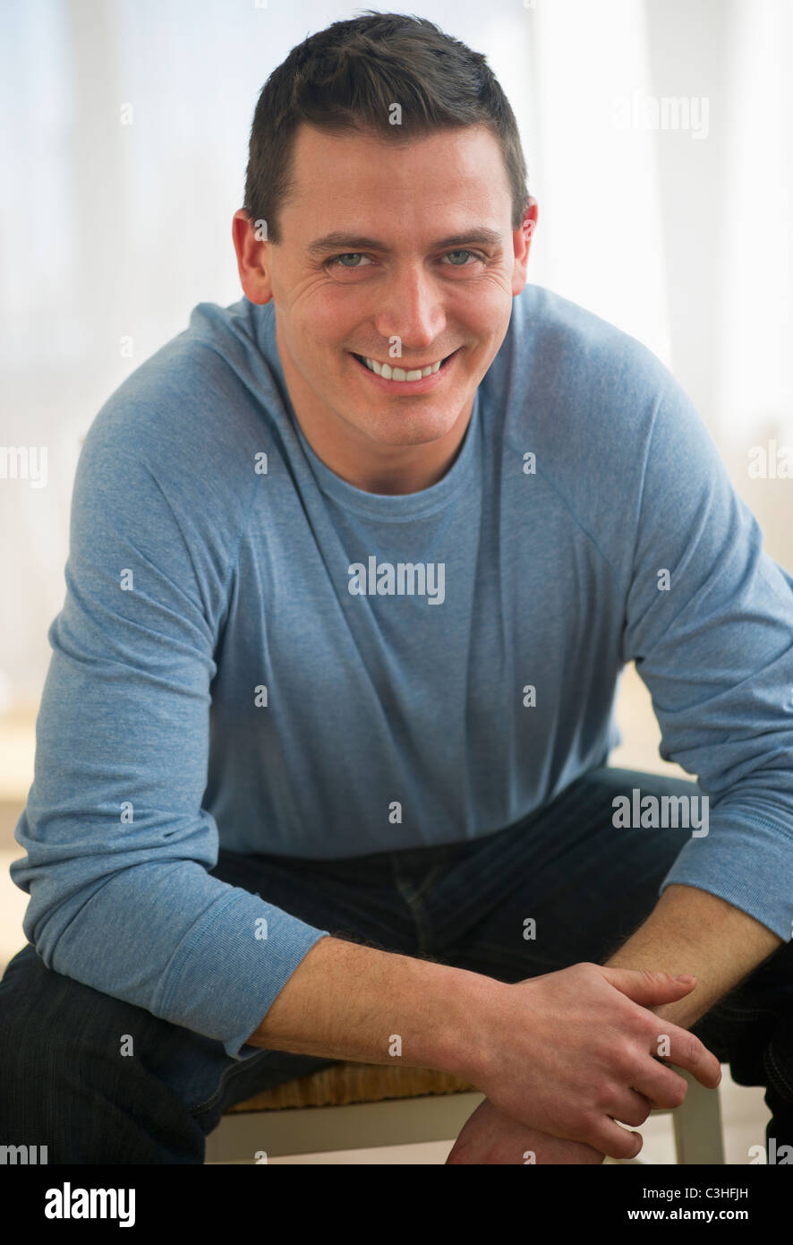Portrait of mid adult man smiling Stock Photo - Alamy