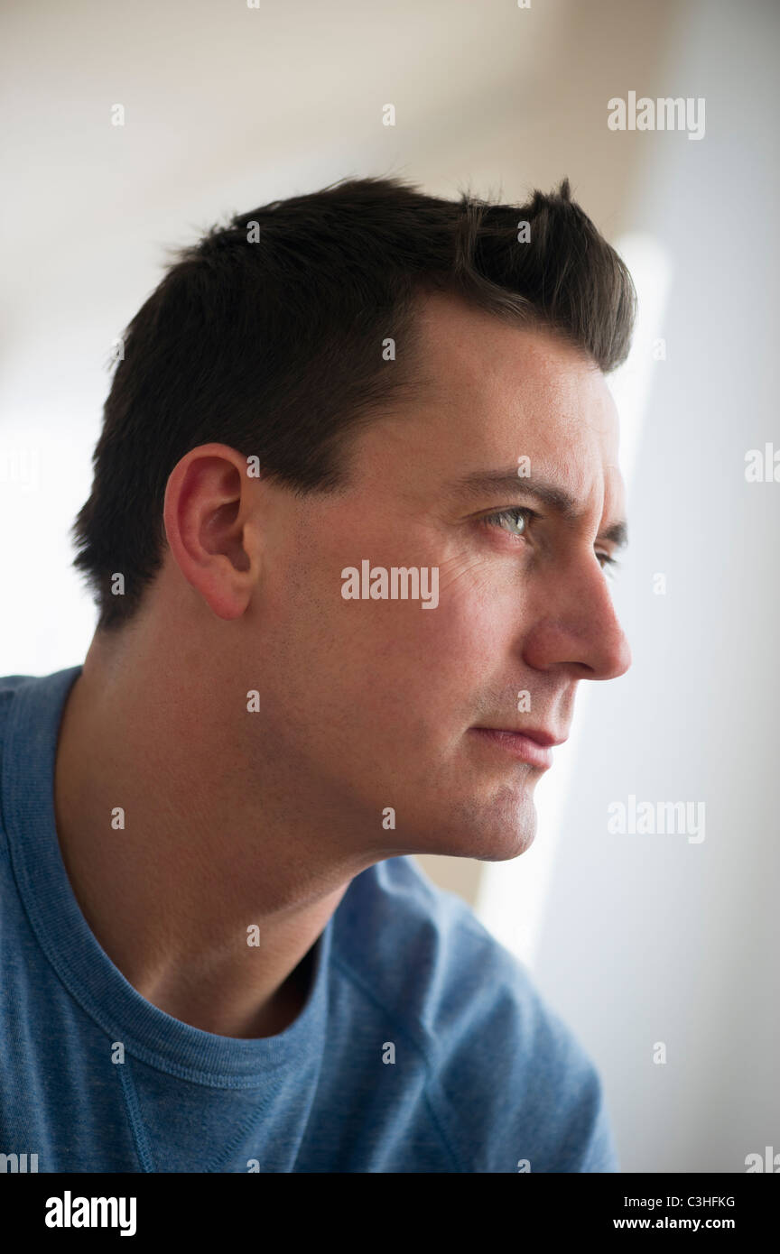 Profile of mid adult man Stock Photo - Alamy