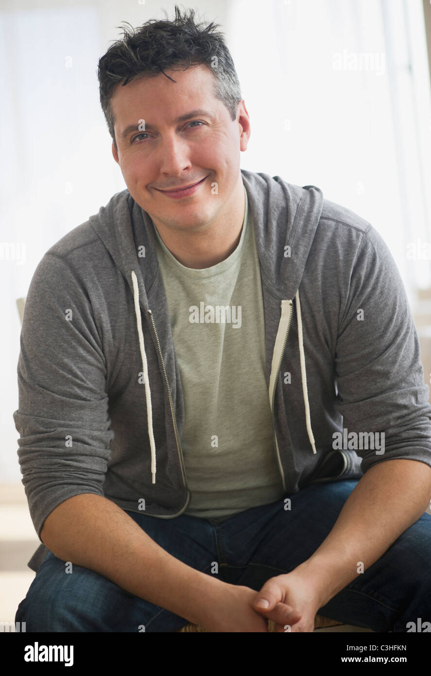 Portrait of mid adult man smiling Stock Photo - Alamy