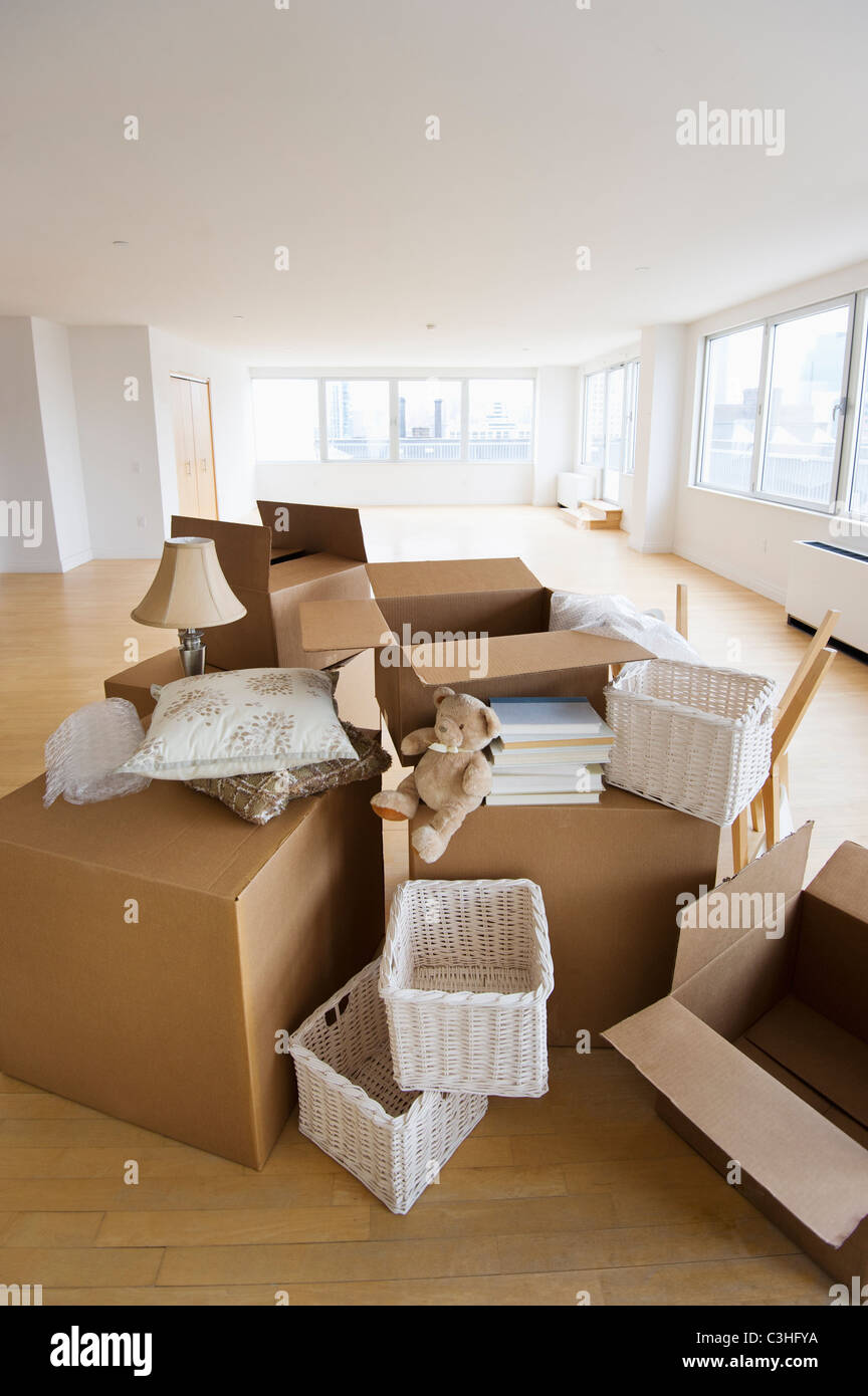 Boxes and decors stacked in room Stock Photo - Alamy