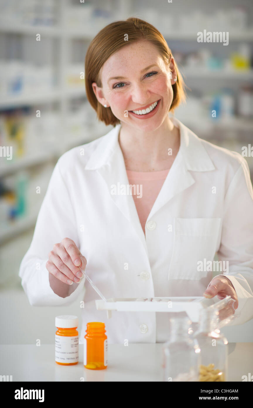 Pharmacist preparing medicine Stock Photo - Alamy