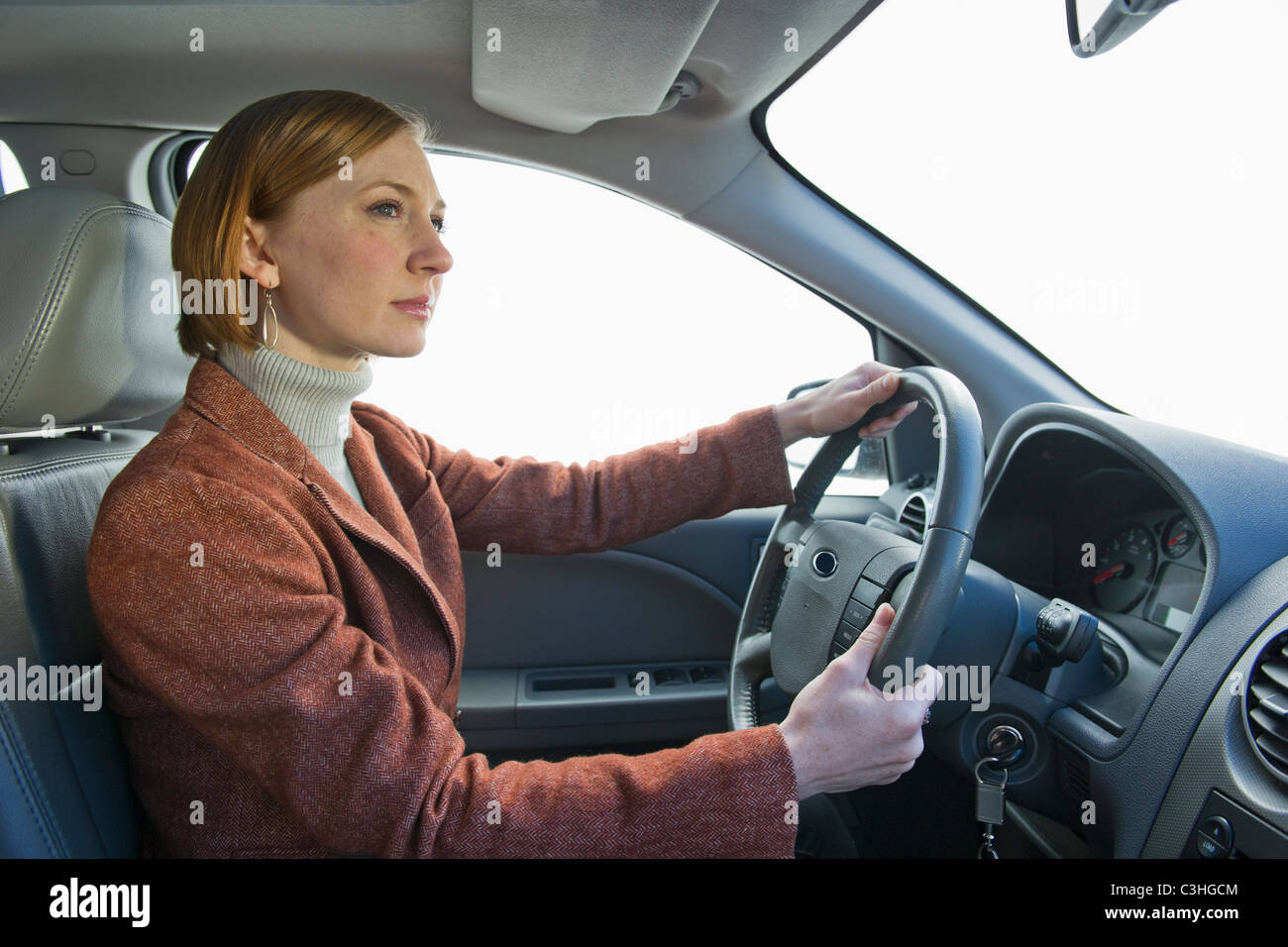 Woman driving car Stock Photo - Alamy