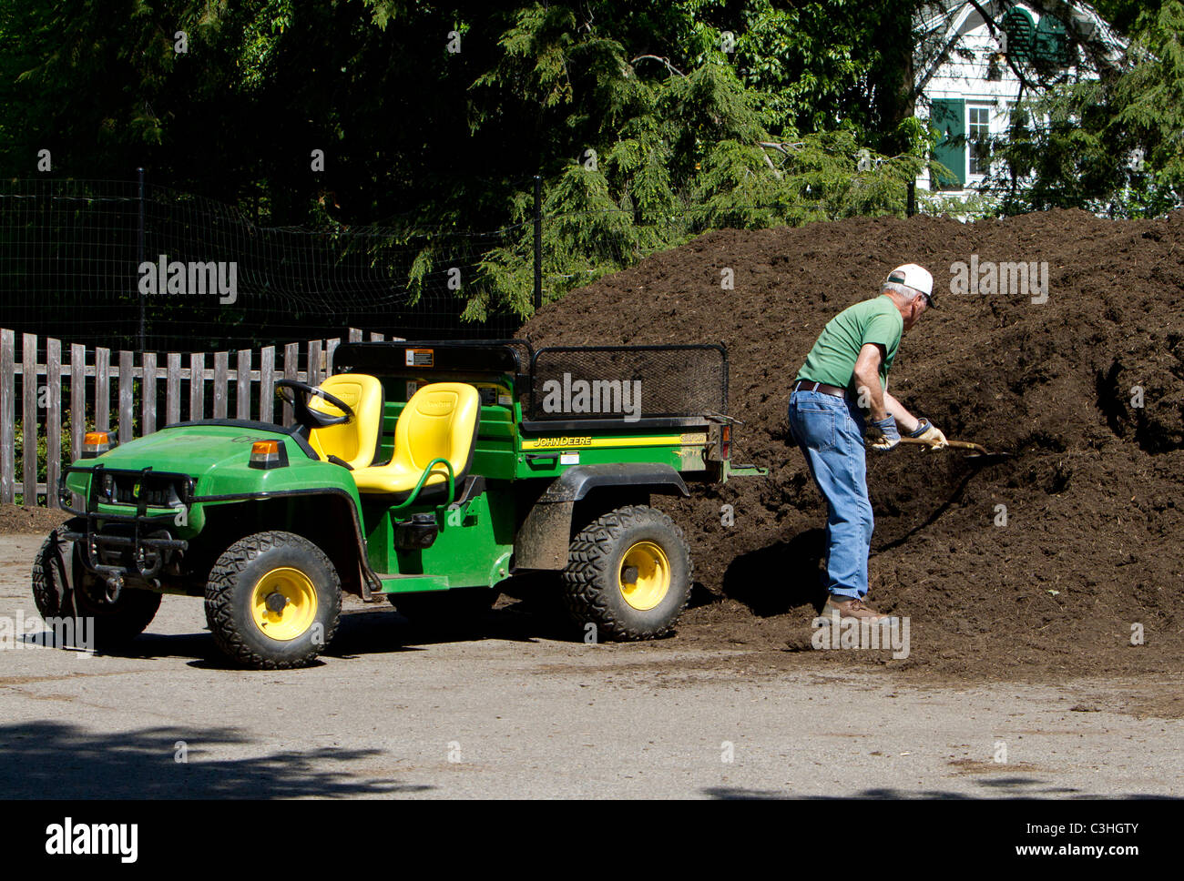 Loading mulch for spreading Stock Photo - Alamy
