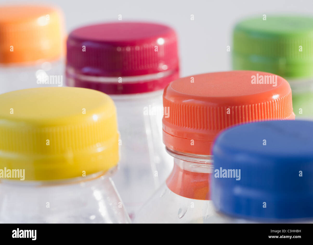 Bottles with colorful caps Stock Photo - Alamy