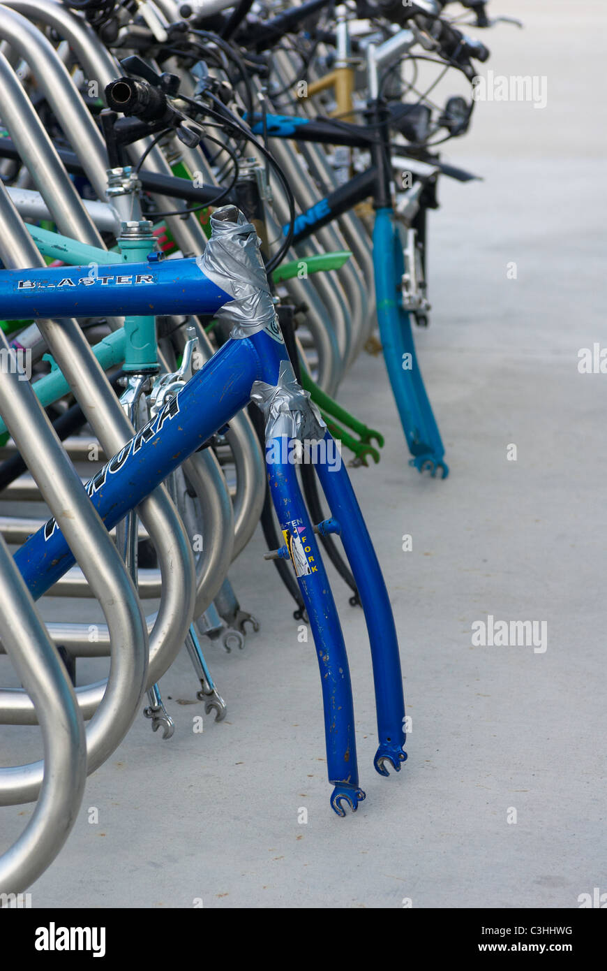 A row of bikes in racks without wheels Stock Photo - Alamy