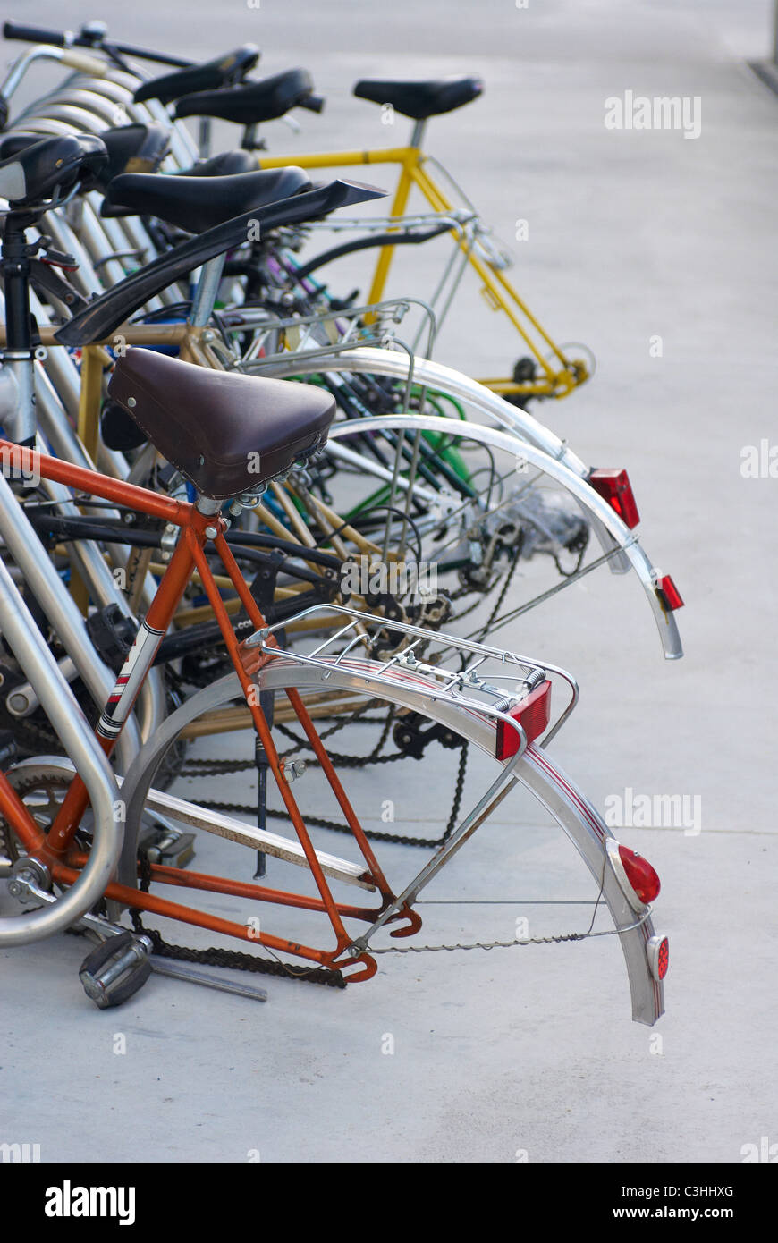 A row of bikes in racks without wheels Stock Photo - Alamy