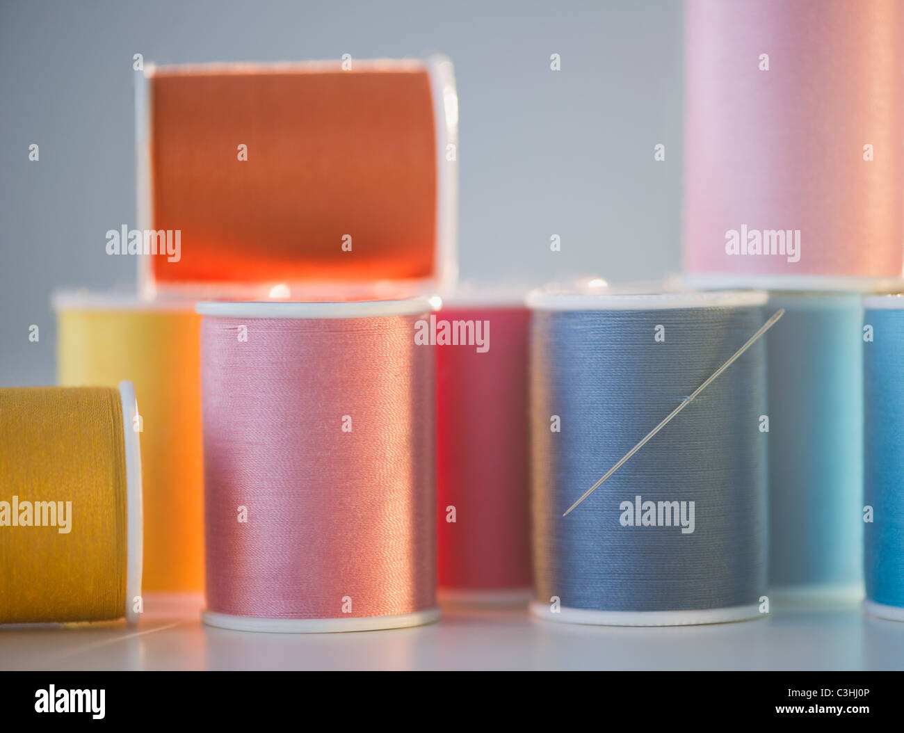 Spools with colorful threads Stock Photo - Alamy
