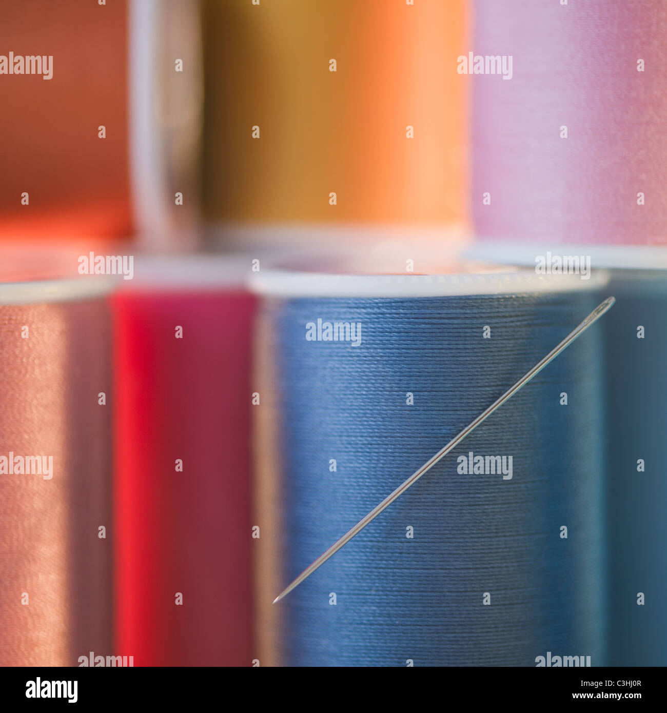 colorful sewing threads on spools isolated over white Stock Photo - Alamy