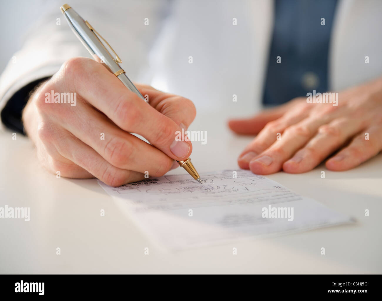 Hand writing prescription Stock Photo - Alamy