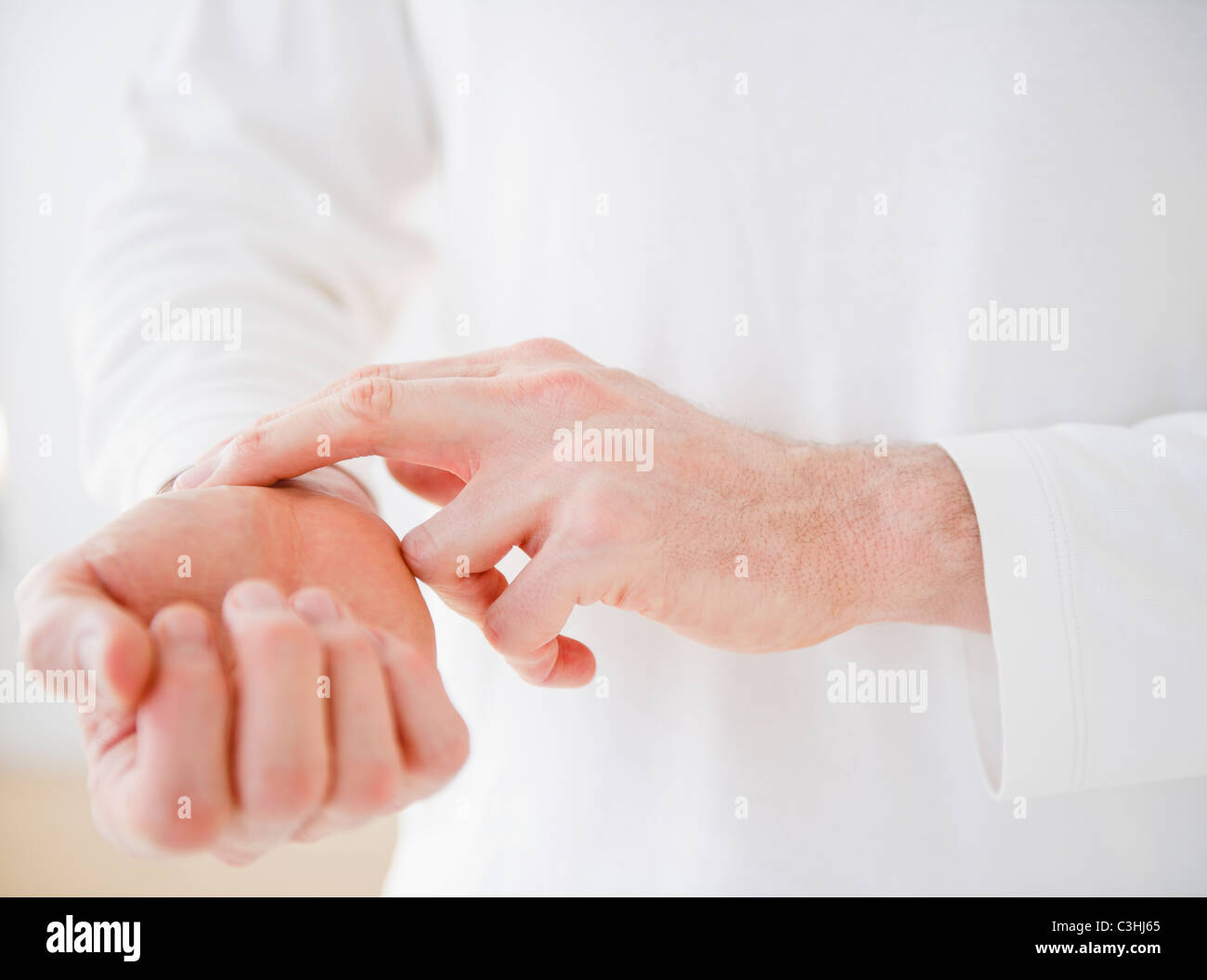 Hands taking pulse Stock Photo - Alamy Hands taking pulse Stock Photo - Alamy