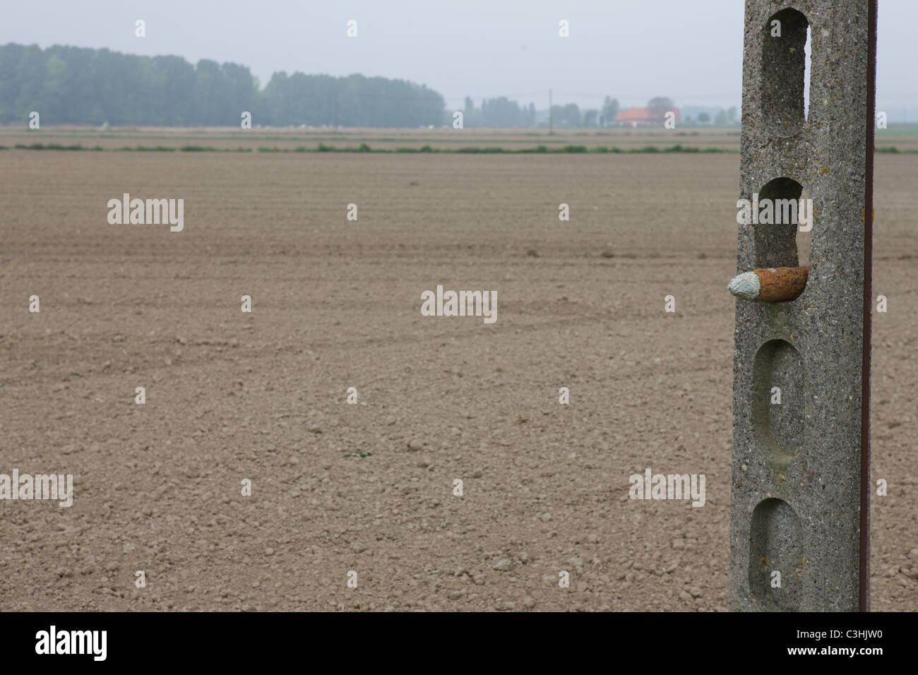 Unexploded shell awaiting collection. Farmers plough these up regularly ...