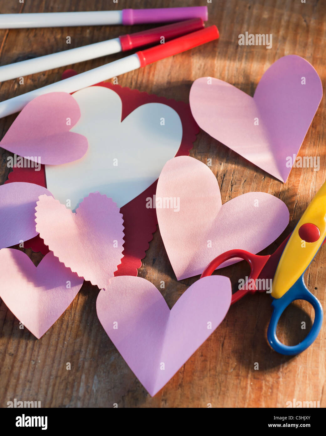 Studio shot of heart-shaped paper cutouts Stock Photo - Alamy