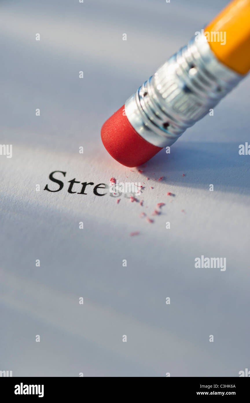 Studio shot of pencil erasing the word stress from piece of paper Stock ...