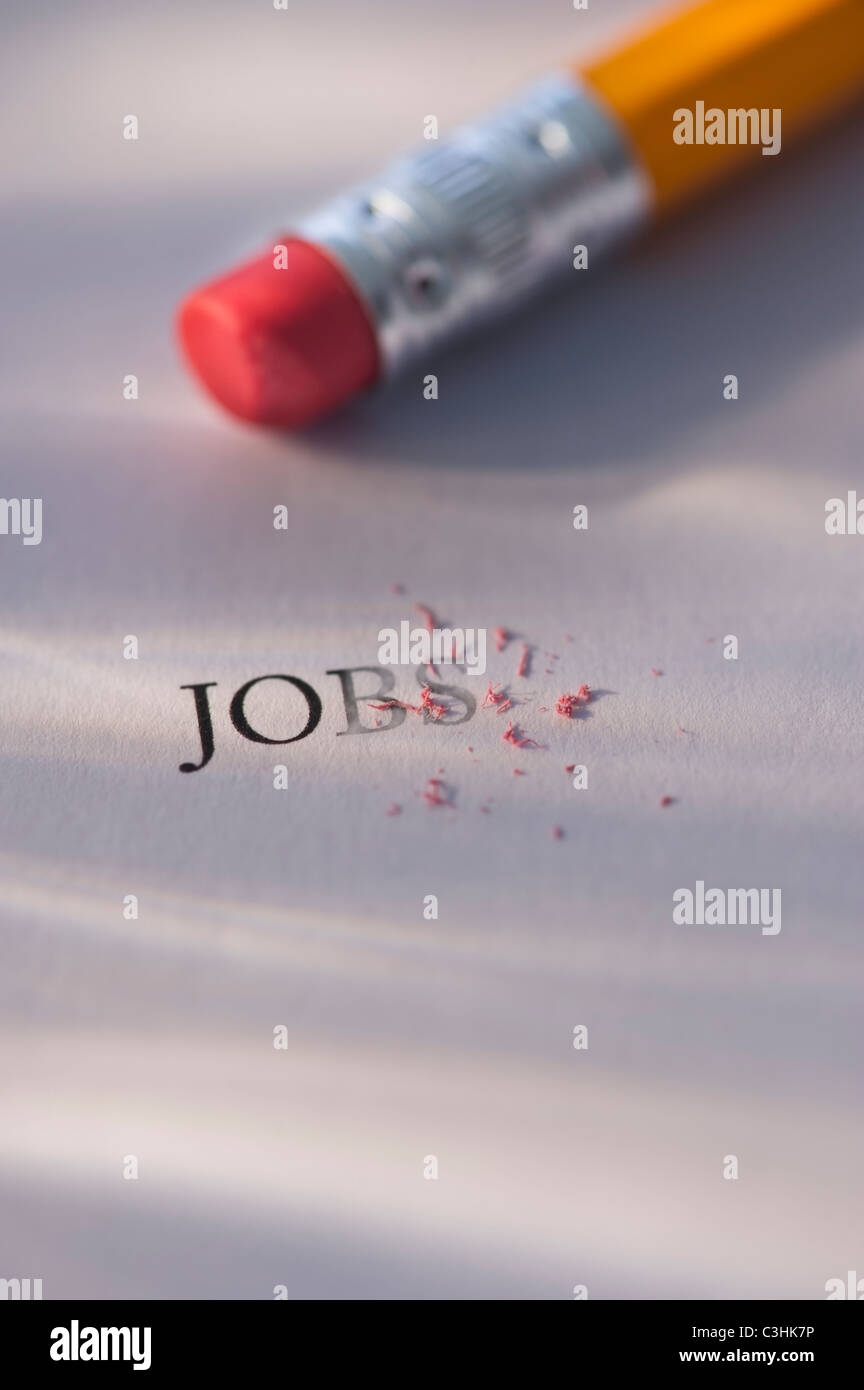 Studio shot of pencil erasing the word jobs from piece of paper Stock ...