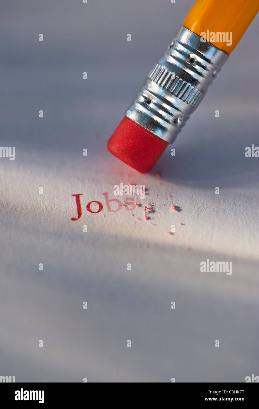 Studio shot of pencil erasing the word jobs from piece of paper Stock ...