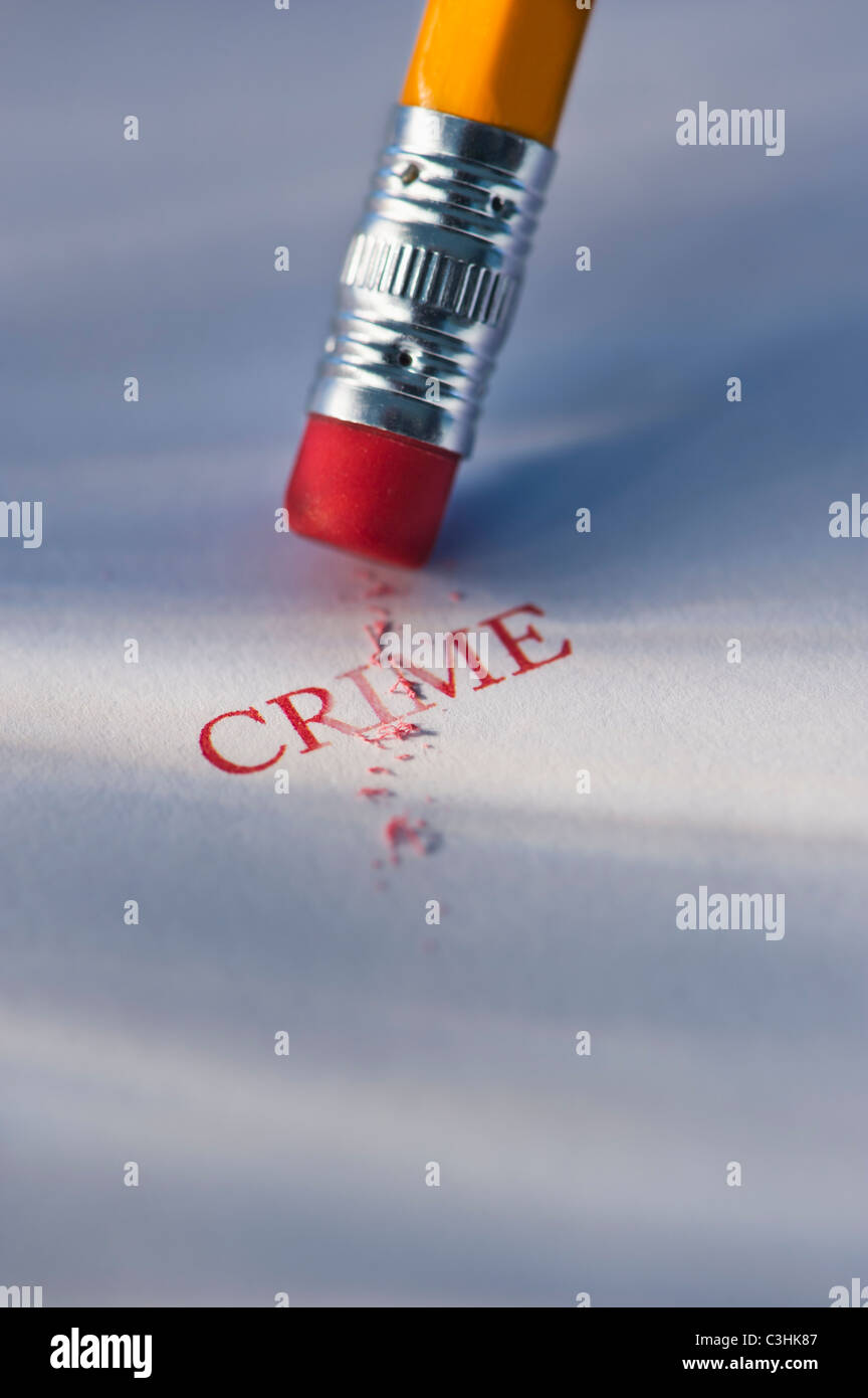 Studio shot of pencil erasing the word crime from piece of paper Stock ...
