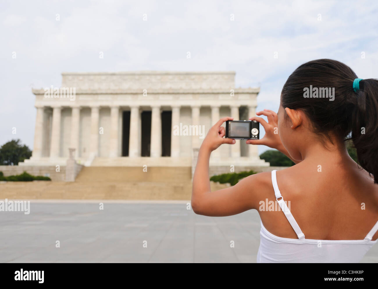 USA, Washington DC, girl (6-7) photographing Lincoln Memorial Stock ...