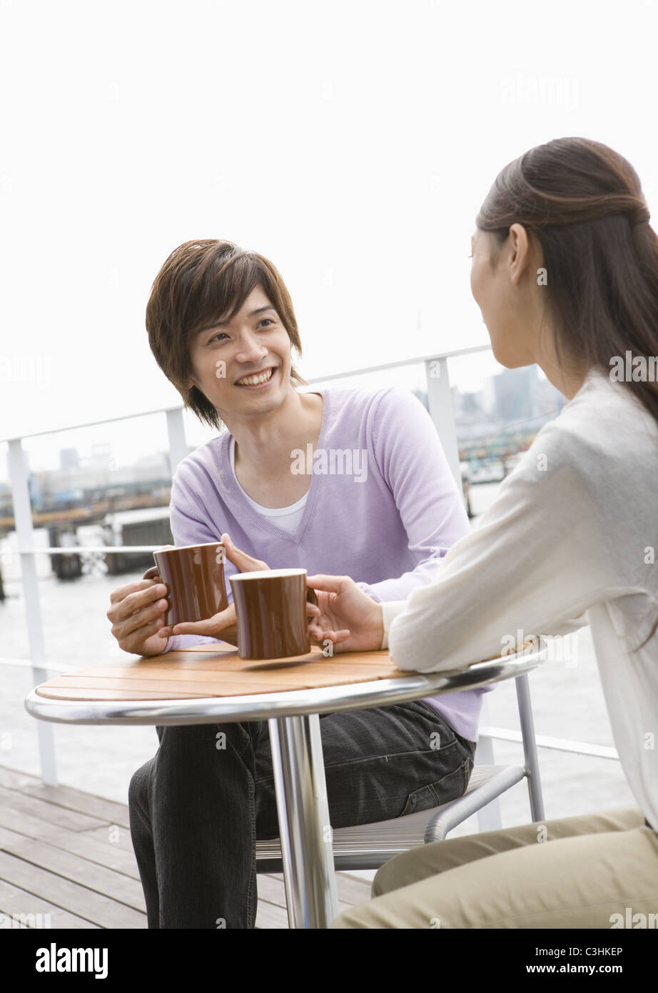 Couple having tea time Stock Photo - Alamy