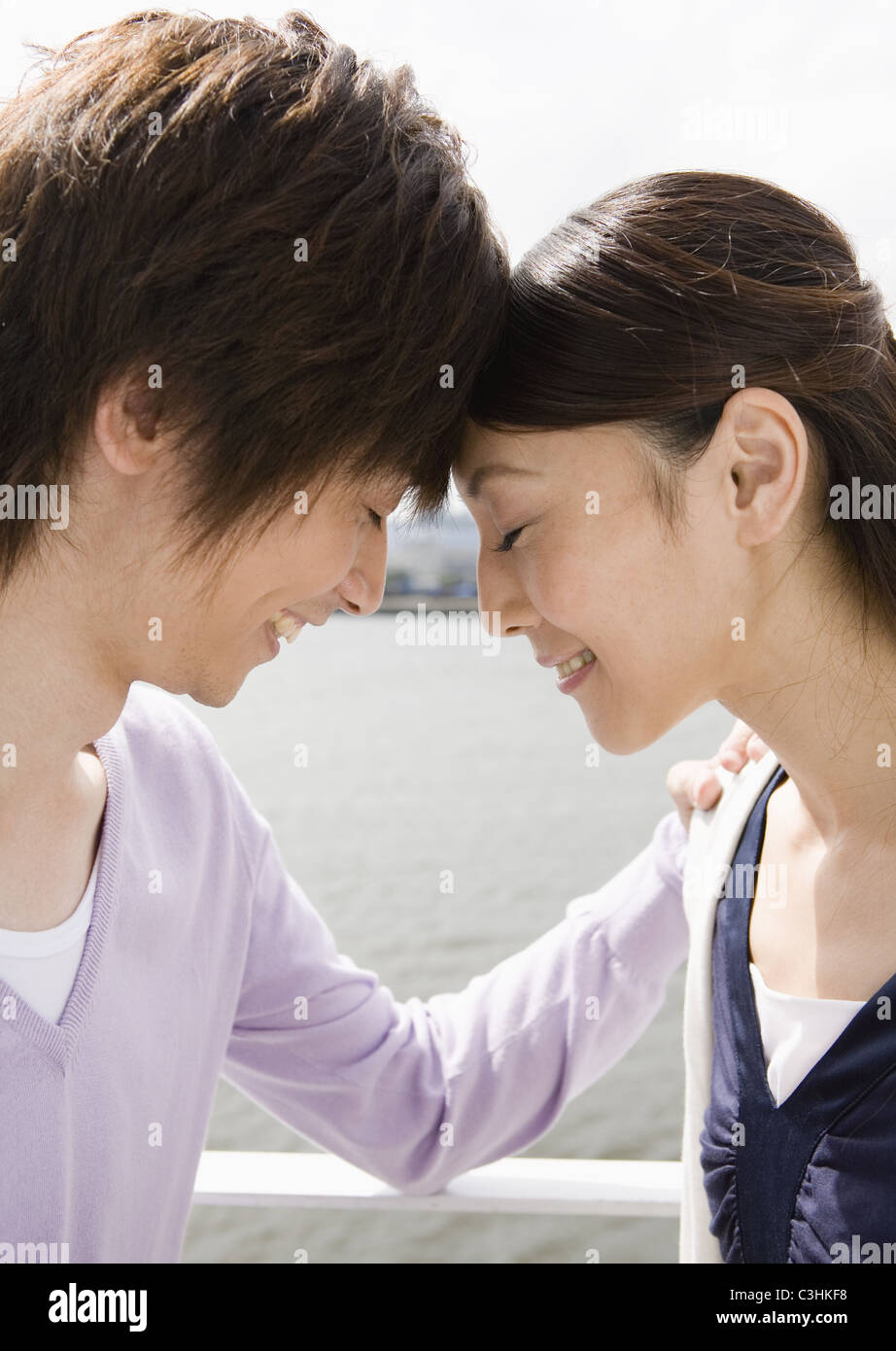 Couple with their foreheads together Stock Photo - Alamy