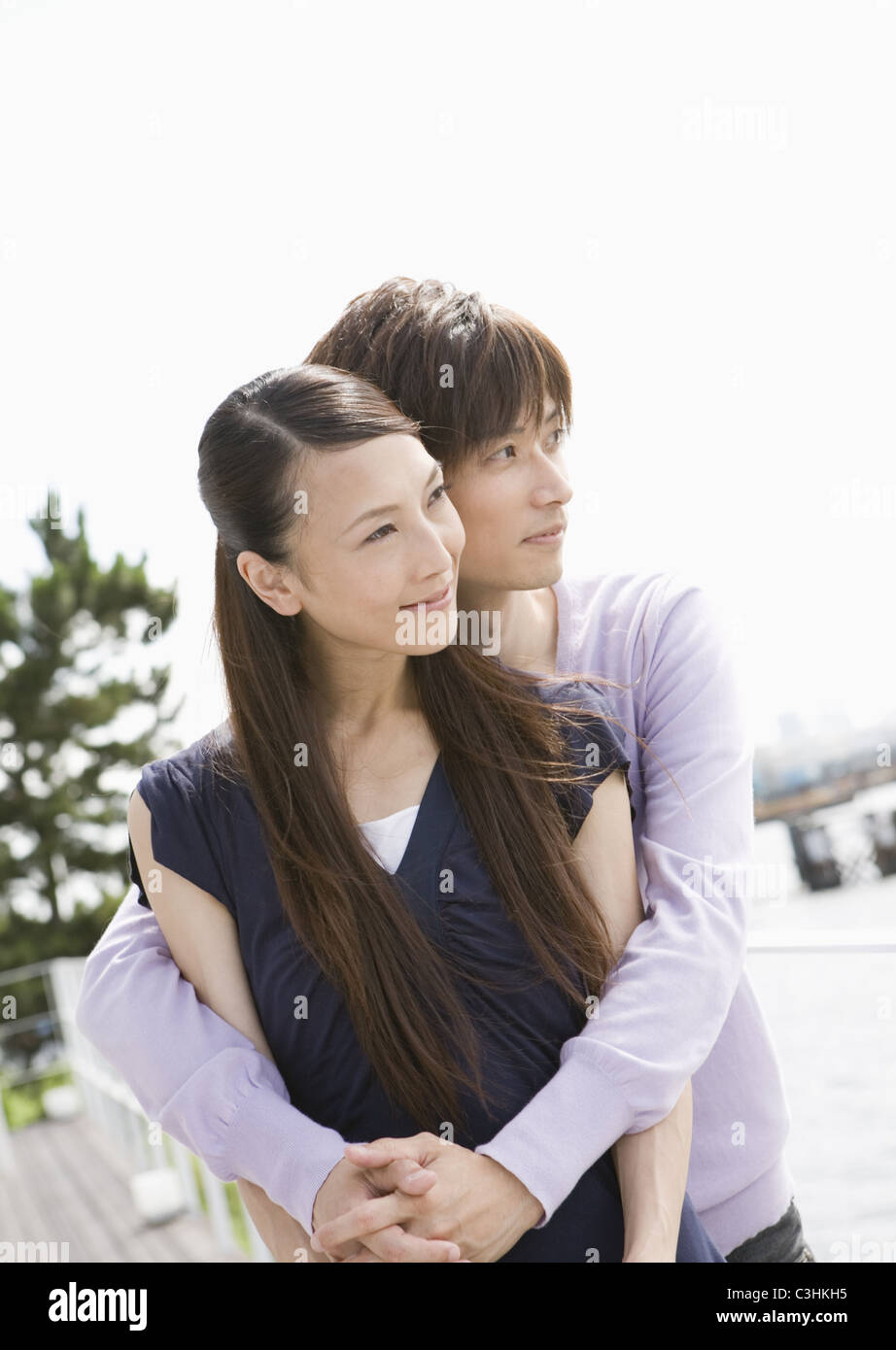 Couple cuddling up Stock Photo - Alamy