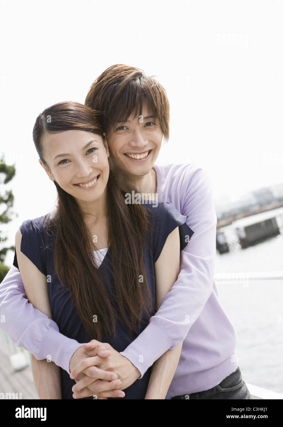 Couple cuddling up Stock Photo - Alamy