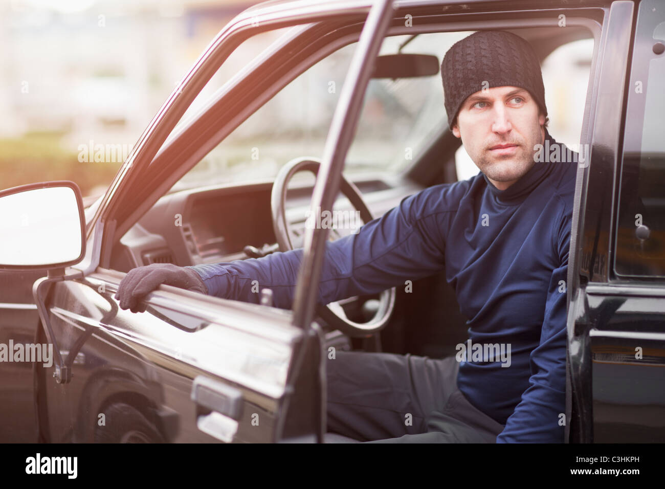 Man sitting in door opening hi-res stock photography and images - Alamy