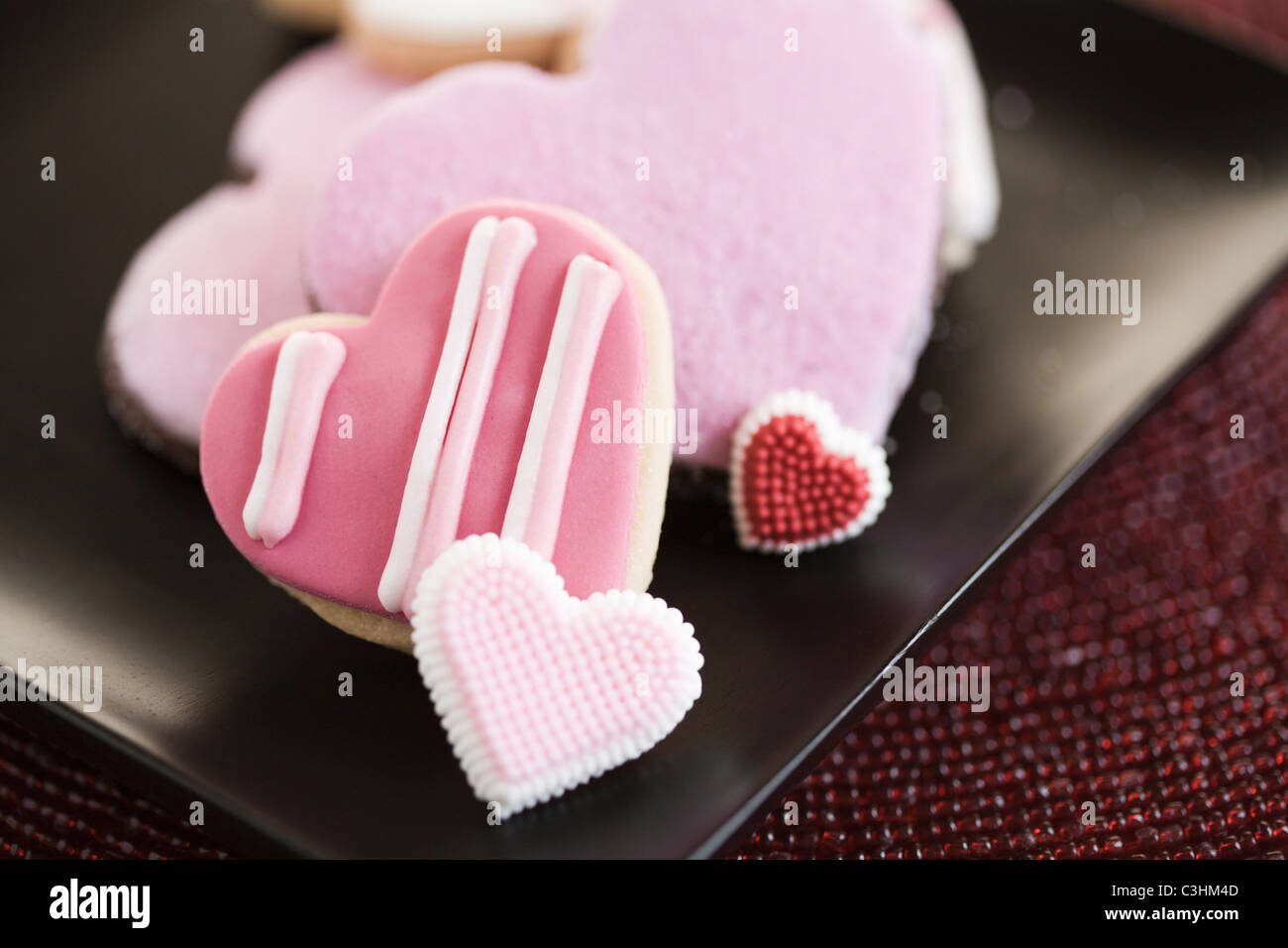 Pink heart-shaped sweets Stock Photo - Alamy