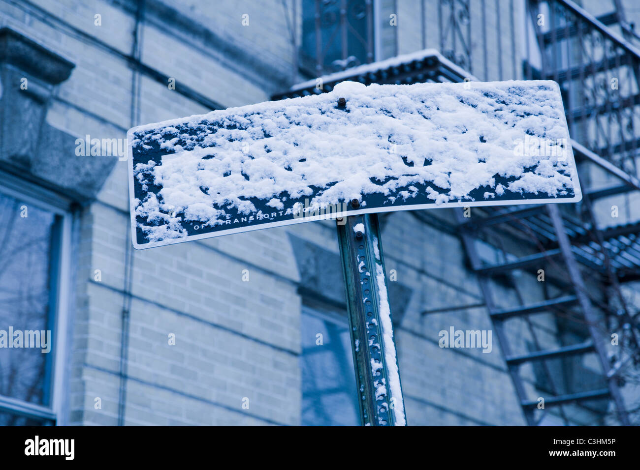 Arrow sign covered with snow Stock Photo - Alamy