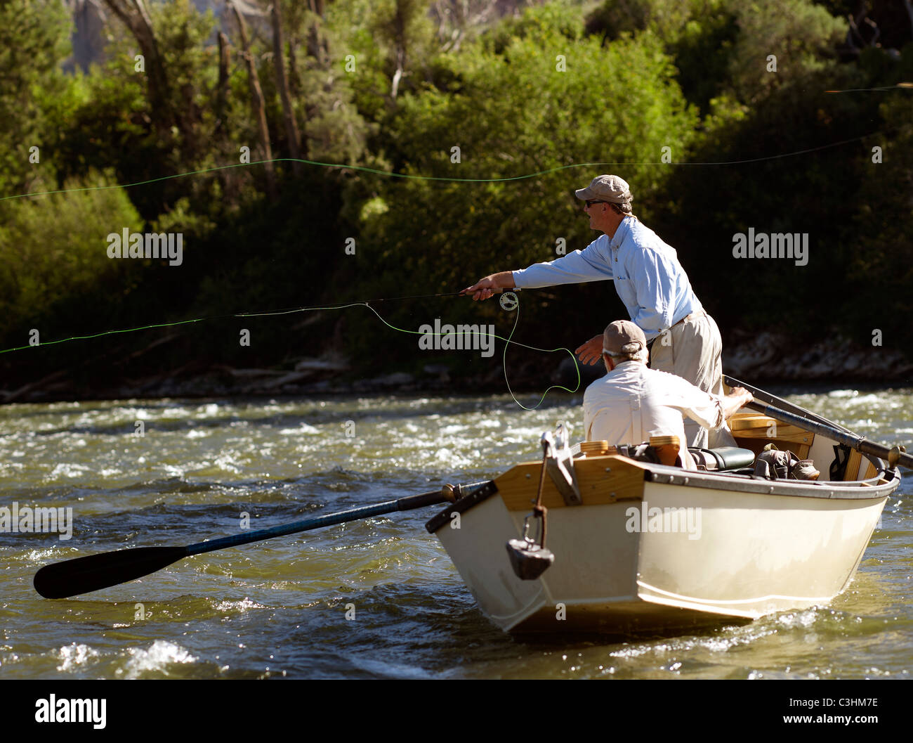 Pair of men fly-fishing Stock Photo - Alamy