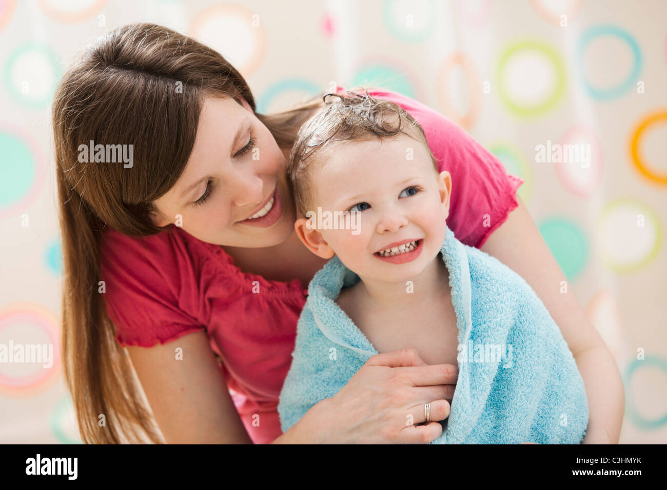 Mother with son (2-3) wrapped in towel Stock Photo - Alamy