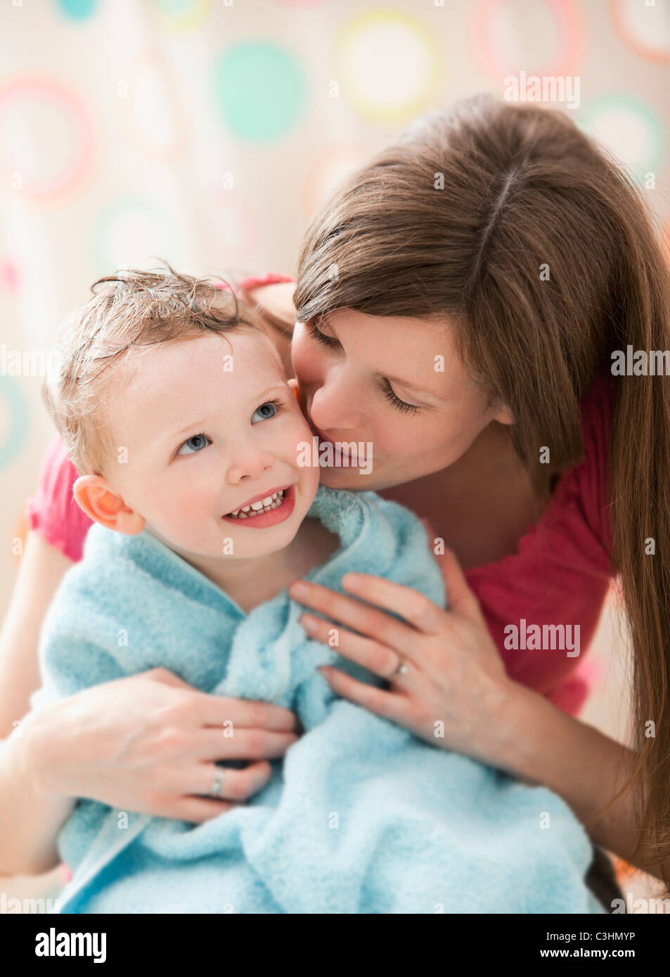 Mother with son (2-3) wrapped in towel Stock Photo - Alamy