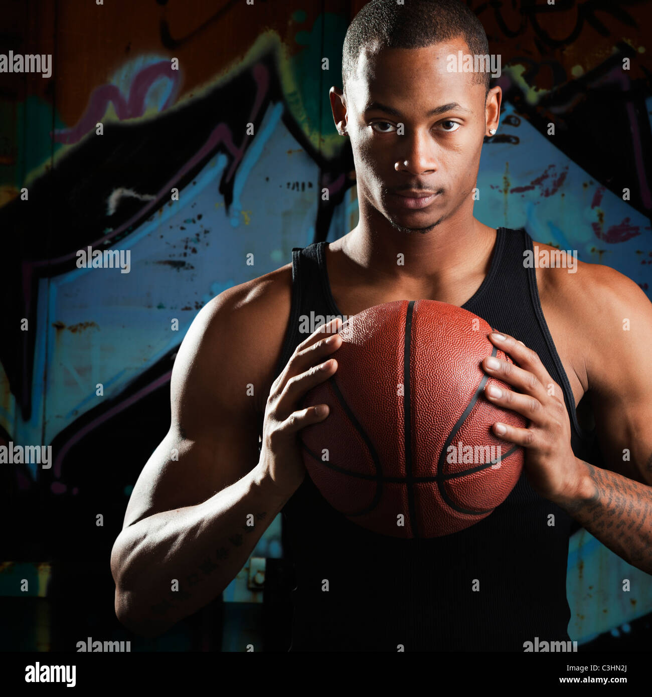 Portrait of young man with basketball Stock Photo - Alamy